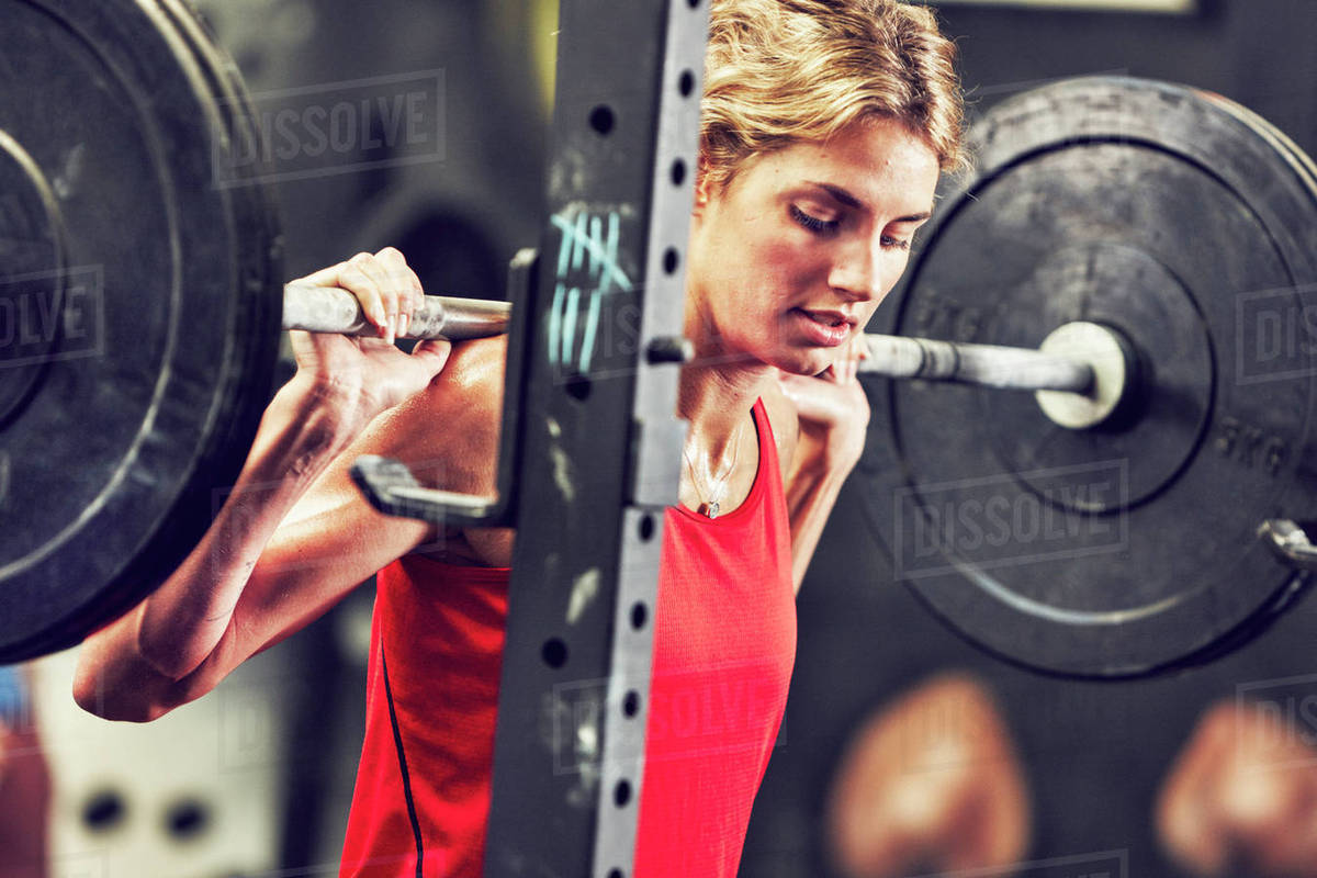 Woman training in gym - Royalty-free Stock Photo | Dissolve