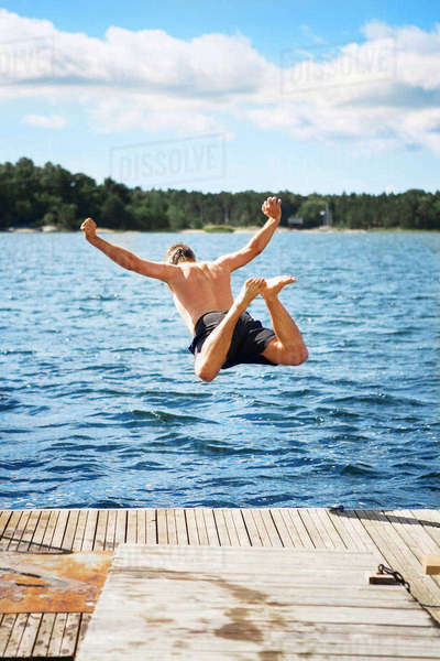 Man jumping into water - Royalty-free Stock Photo | Dissolve