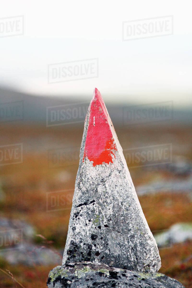 Sharp stone painter red, close-up - Stock Photo - Dissolve