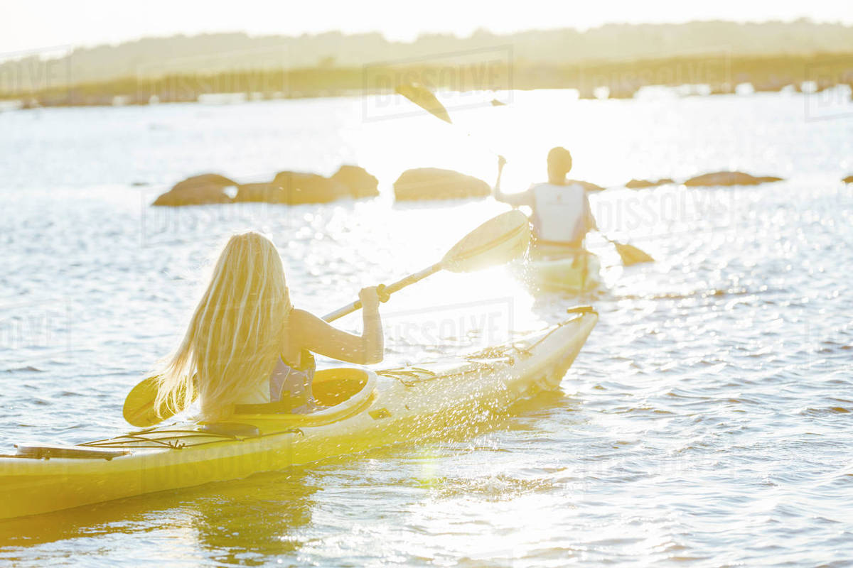 Women kayaking at evening - Royalty-free Stock Photo | Dissolve