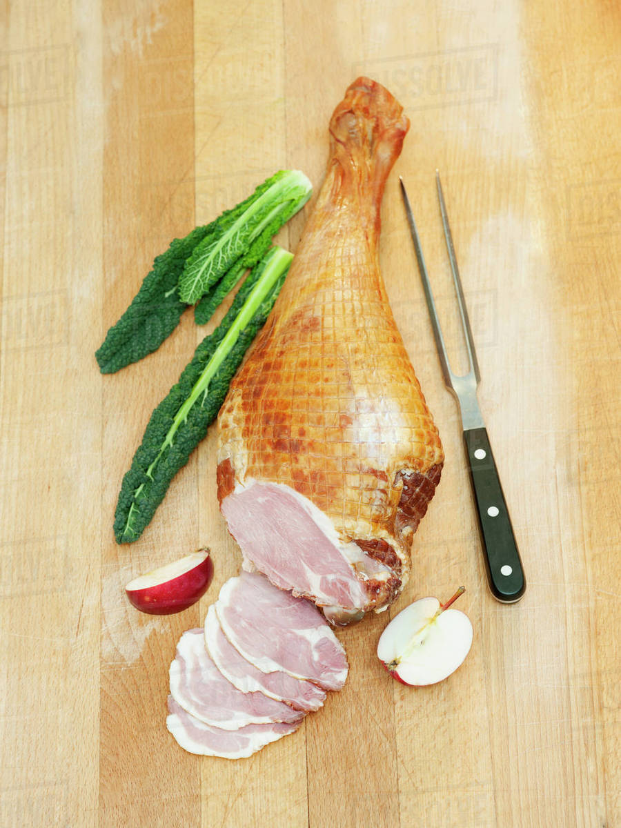 Ham on wooden background - Stock Photo - Dissolve