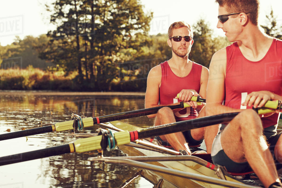 Young men canoeing - Stock Photo - Dissolve