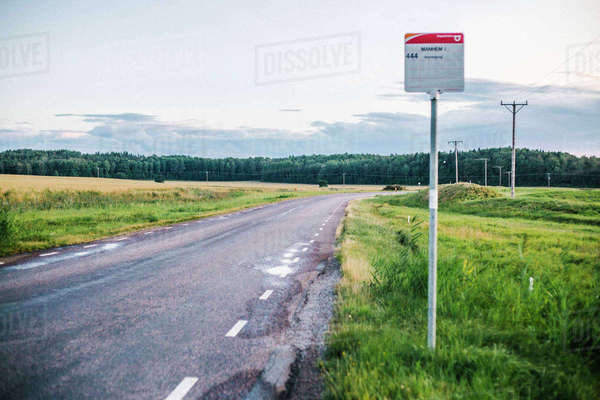 Bus stop on country road - Royalty-free Stock Photo | Dissolve