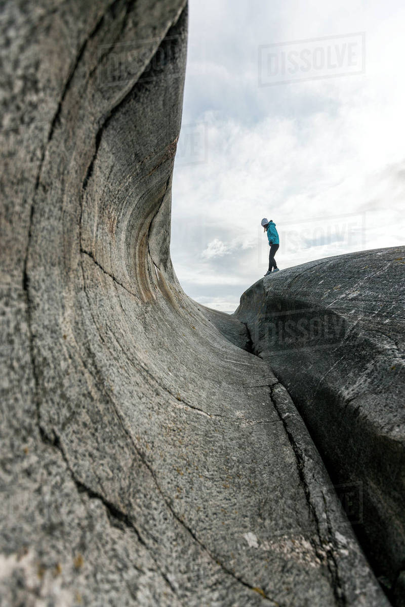 Person on rocks - Royalty-free Stock Photo | Dissolve