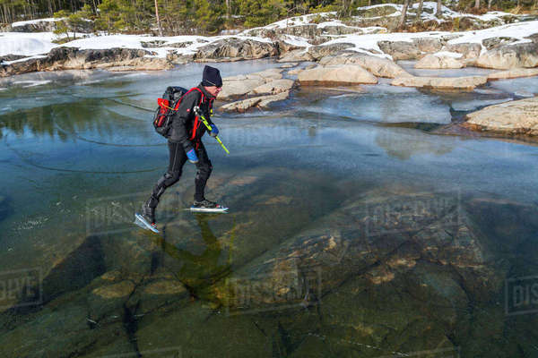 Man long-distance skating - Stock Photo - Dissolve