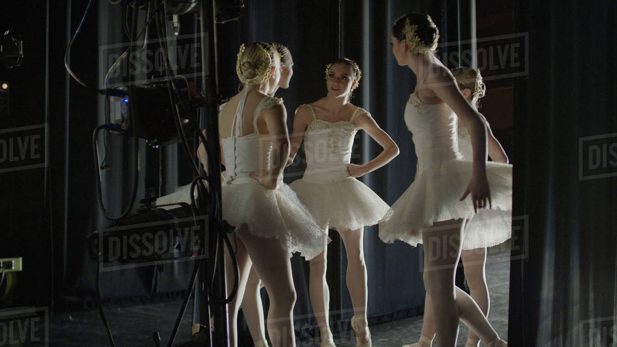 Serious ballet dancers in costume standing backstage during show ... Serious ballet dancers in costume standing backstage during show ...