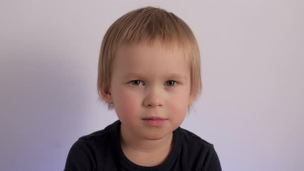 Portrait of adorable cute baby frown before laughing having fun and ...