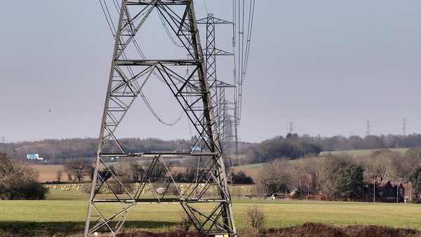 Rows of High Voltage Lattice Pylon Power Line Towers Aerial View ...