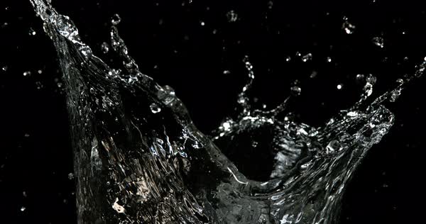 Water exploding and splashing against black background - Stock Video ...
