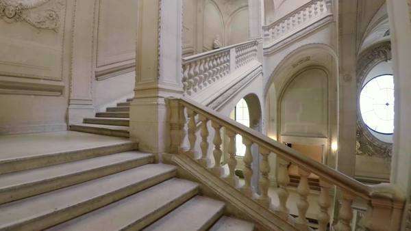 The magnificent staircase in the Louvre Museum in Paris, France ...