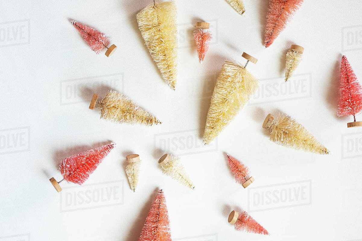 Colourful artificial mini Christmas trees layout. Winter holidays ...