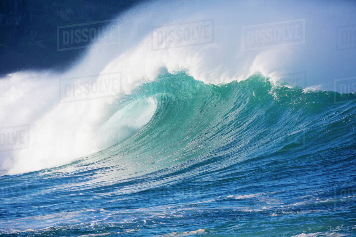 Waves breaking at Waimea Bay on the North shore of Oahu; Oahu, Hawaii ...
