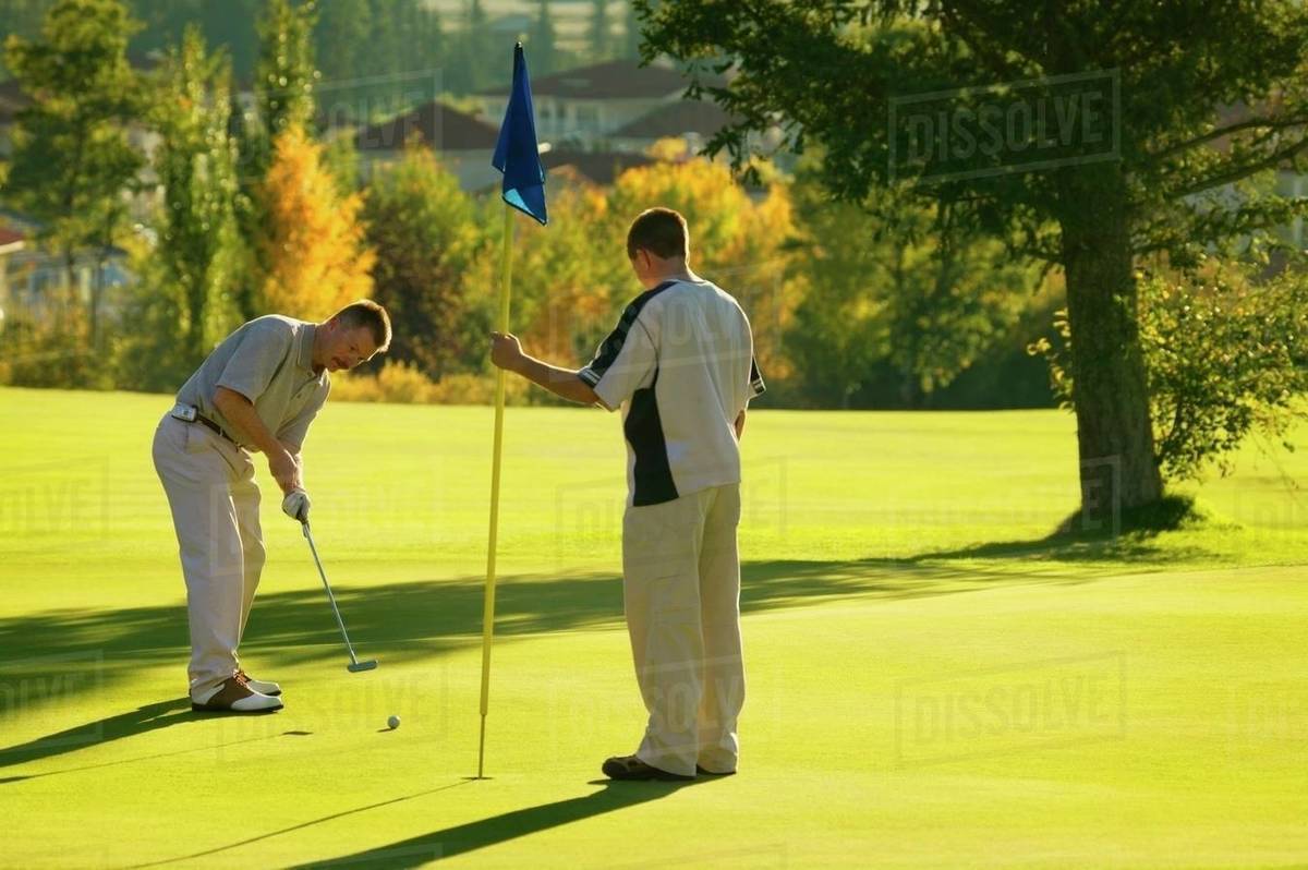 Making The Putt - Stock Photo - Dissolve