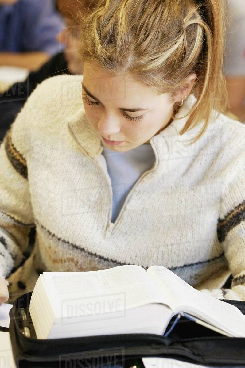 Student With Text Book - Royalty-free Stock Photo | Dissolve