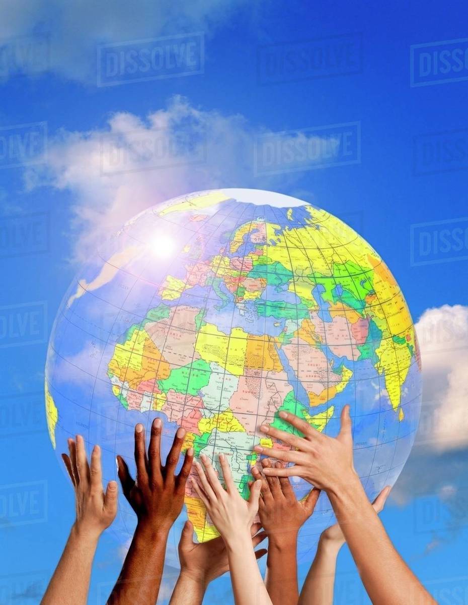 Hands On A Globe - Stock Photo - Dissolve
