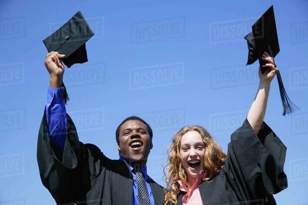 Two Graduates Celebrating - Royalty-free Stock Photo | Dissolve