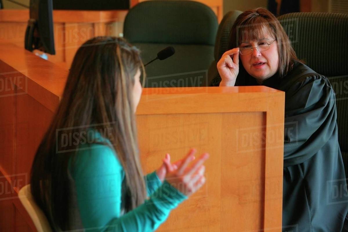 A Teenage Girl Talking To A Judge - Royalty-free Stock Photo | Dissolve