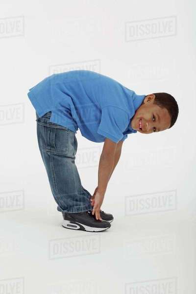 A Boy Touching His Toes - Royalty-free Stock Photo | Dissolve