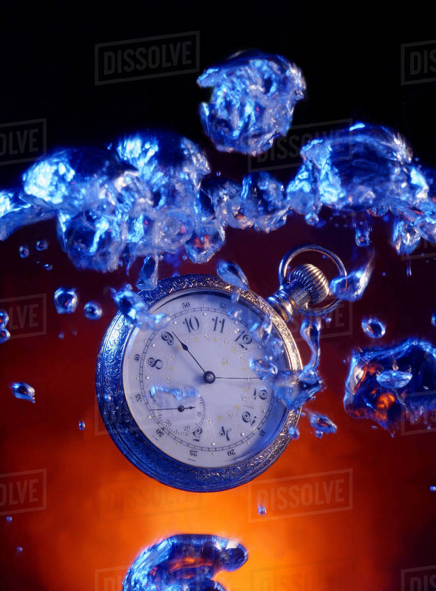 Suspended Pocket Watch And Water - Stock Photo - Dissolve