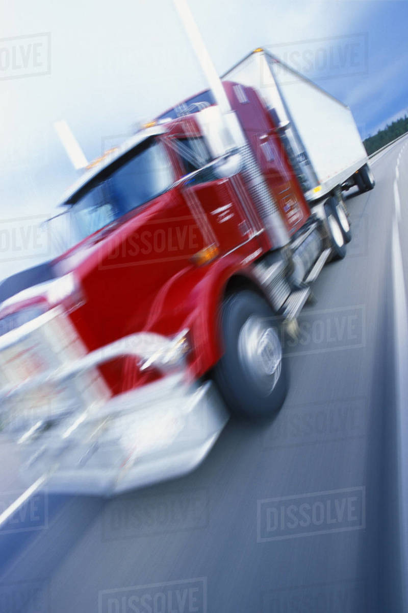Semi Truck Driving On Highway - Royalty-free Stock Photo | Dissolve