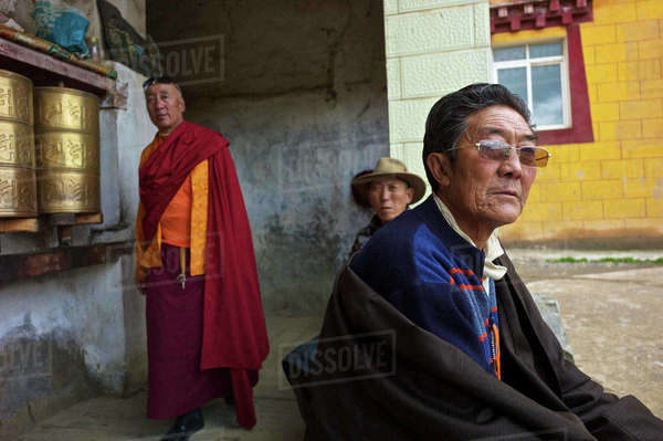 Tibetan Men At A Temple; Garze, Sichuan, China - Stock Photo - Dissolve