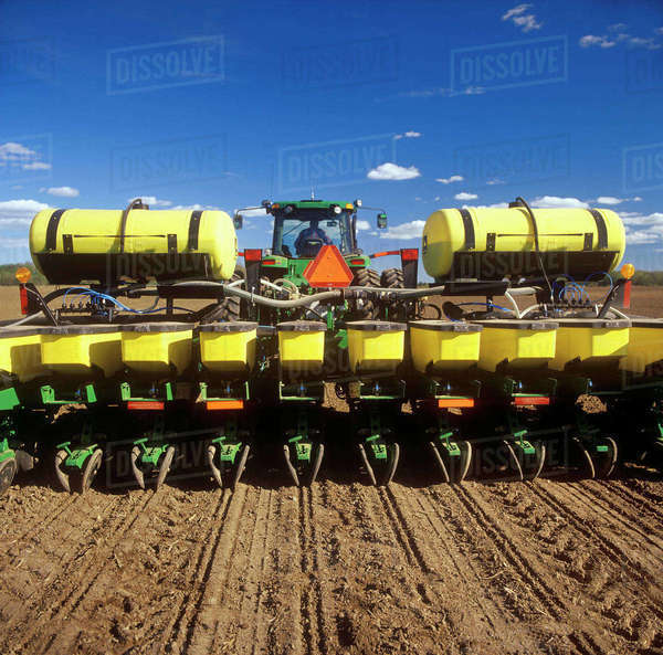 Agriculture - Rear view closeup of a John Deere tractor and 24-row ...