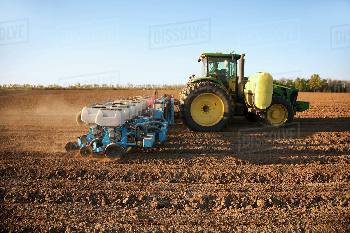 Agriculture - A John Deere tractor and Monosem 24 twin-row planter ...