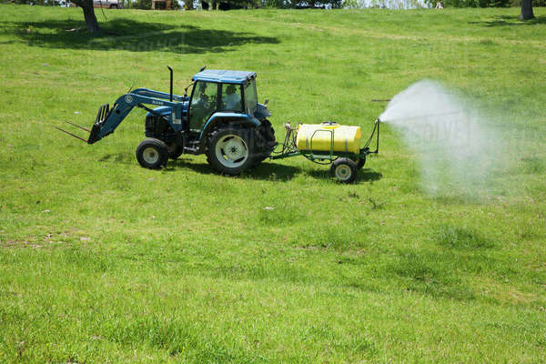 Agriculture - Spraying herbicide on a pasture used for grazing beef ...