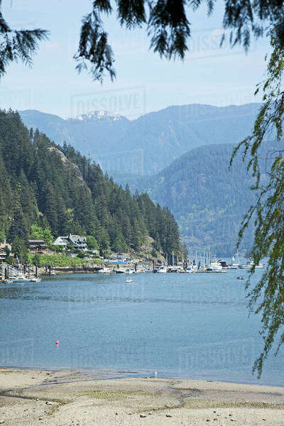 View of Deep Cove from beach with mountains in background, North ...