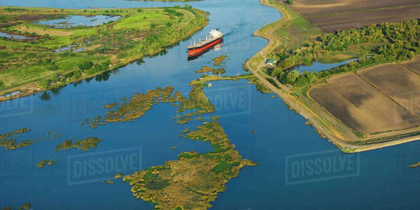 Agriculture - Aerial view of an ocean going grain ship transiting the ...