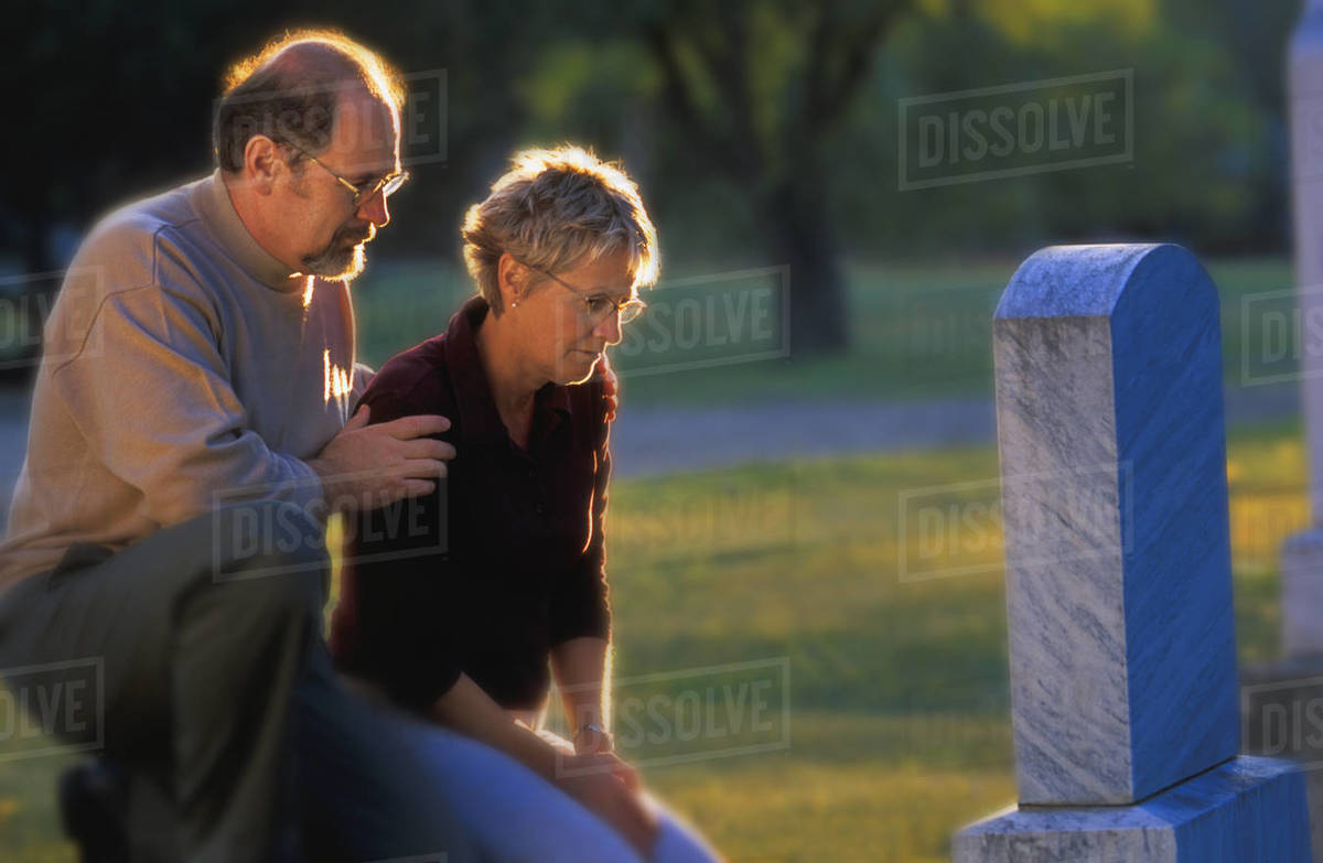Couple Visiting Grave - Royalty-free Stock Photo | Dissolve