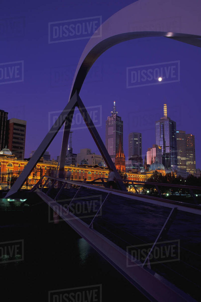Curved Span Of Bridge With City Skyline In Background - Stock Photo ...