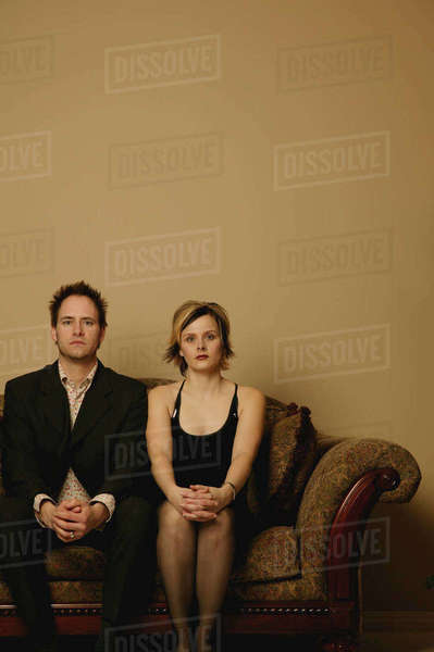 Couple Sitting Side By Side - Royalty-free Stock Photo | Dissolve