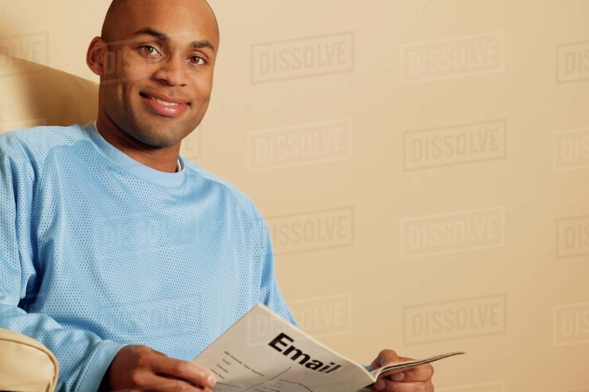 Man Reading A Magazine - Royalty-free Stock Photo | Dissolve