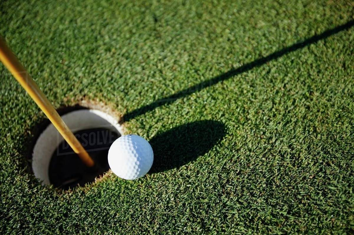 Golf Ball Close To Pin - Royalty-free Stock Photo | Dissolve