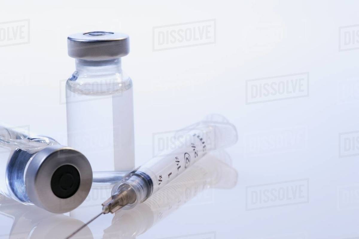 Needle And Vials - Stock Photo - Dissolve