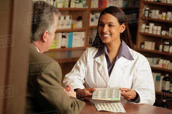 Pharmacist With Patient - Royalty-free Stock Photo | Dissolve