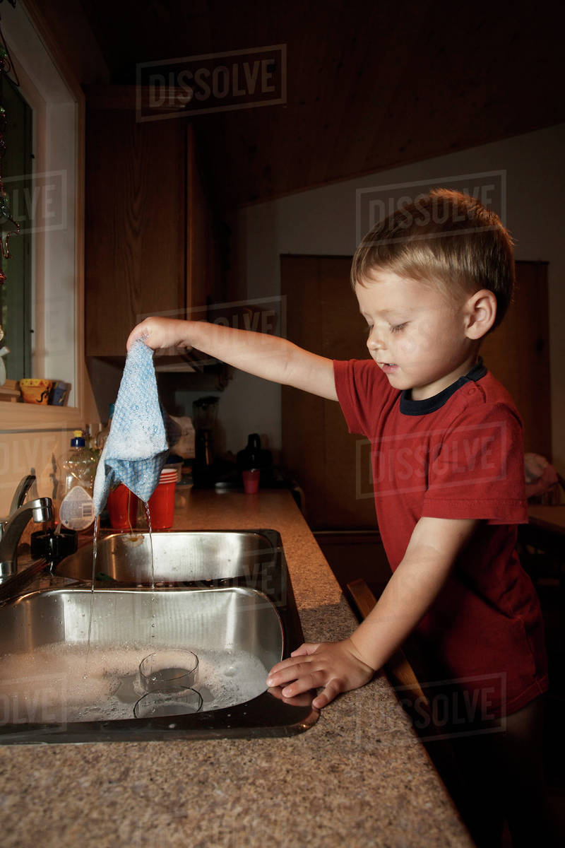 Boy Washing Dishes - Royalty-free Stock Photo | Dissolve