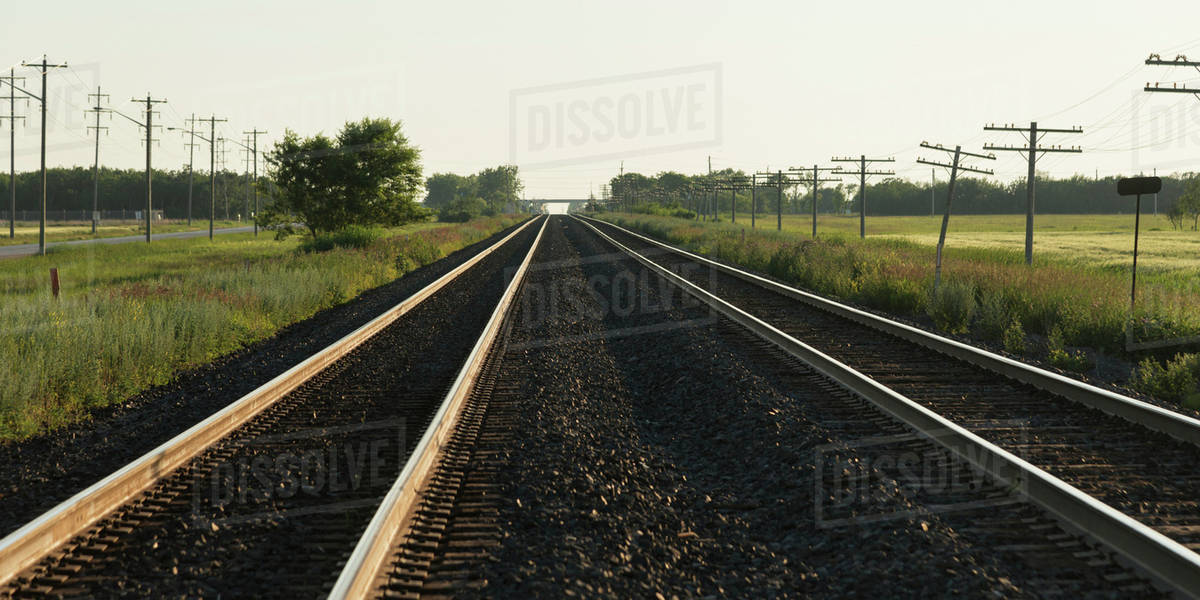 Train tracks leading into the horizon on the prairies; Winnipeg ...
