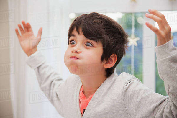 Young boy making a silly face near a window in a bedroom; Langley ...