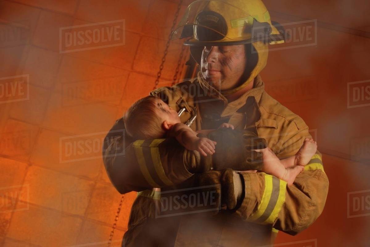 Fireman Rescuing A Baby - Royalty-free Stock Photo | Dissolve