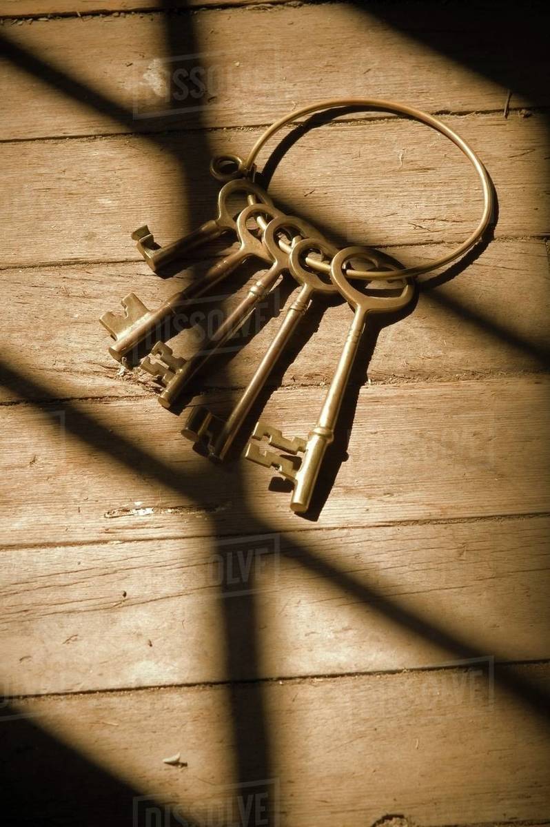 Old-Fashioned Keys On Wood Floor - Stock Photo - Dissolve