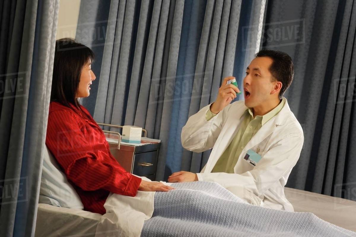 Doctor Demonstrating Inhaler To Patient - Royalty-free Stock Photo ...