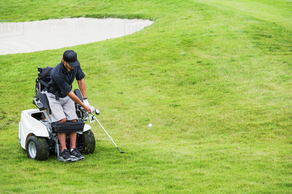 Disabled golfer in a tournament using high tech mobility aid; Edmonton ...