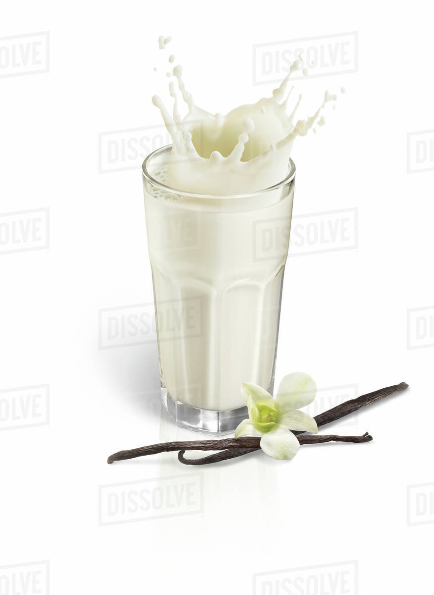 Splashing glass of milk with vanilla flower and bean - Royalty-free ...