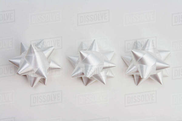 Three White Christmas Gift Bows In Row On White Background Studio ...