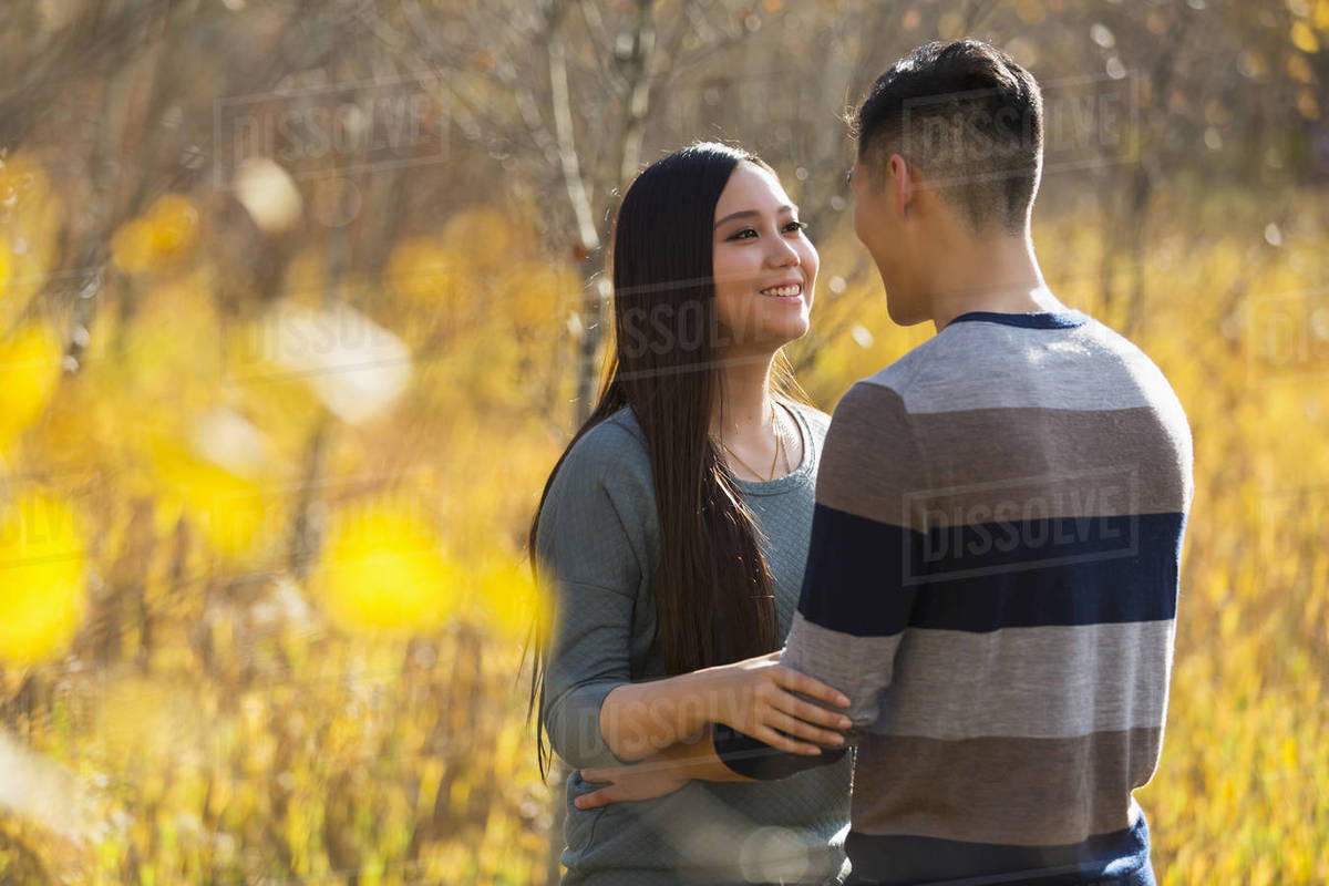 A Young Asian Couple Enjoying A Romantic Time Together Outdoors In A ...