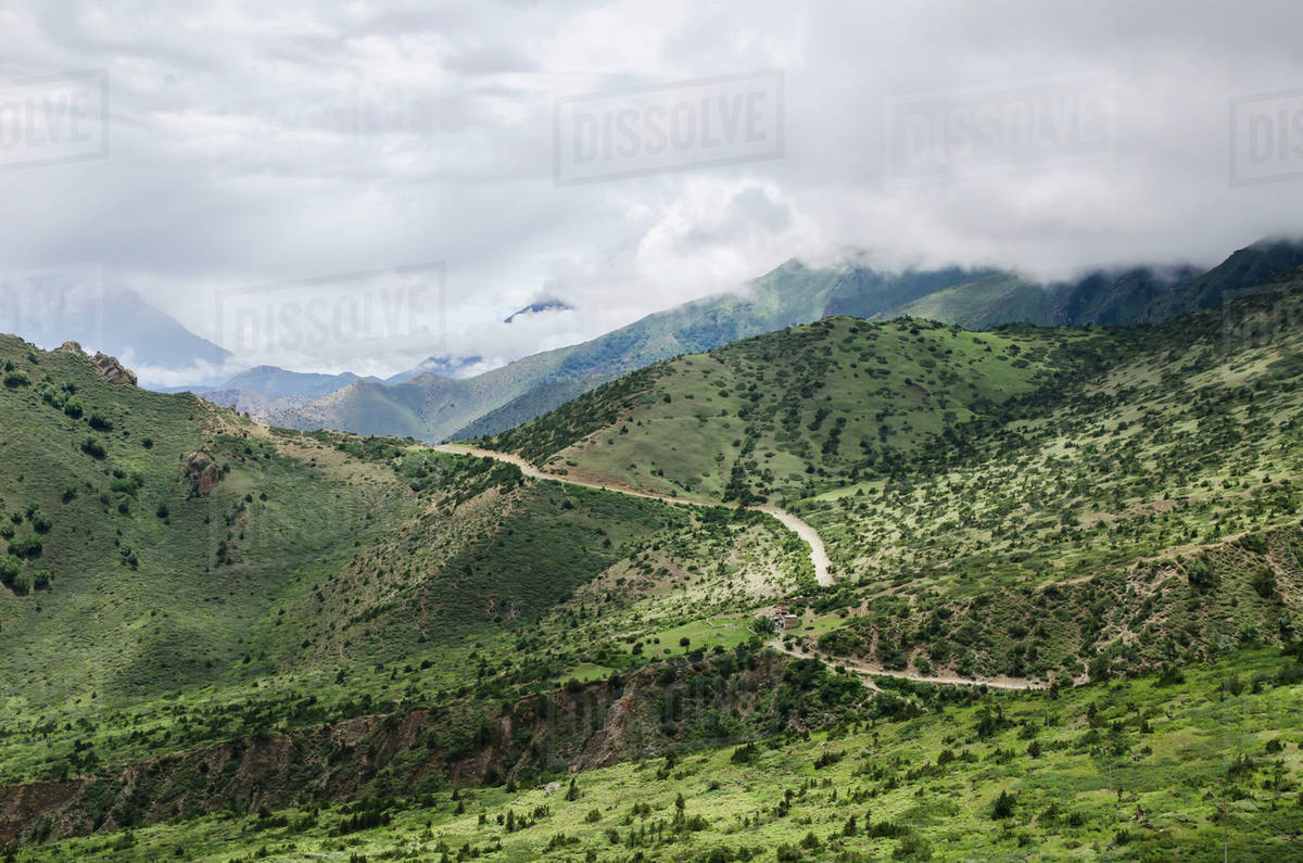 Mountainous landscape and road to the capital of nepalese upper mustang ...