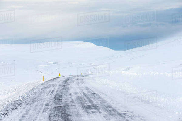 Highway Weaving Through The Snowy Landscape; Northern Iceland - Royalty ...