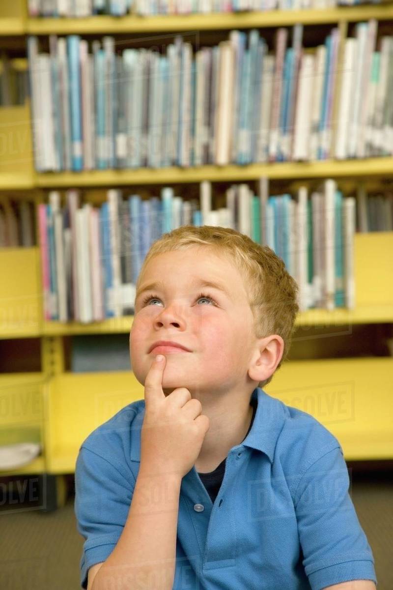 Little Boy In Library - Stock Photo - Dissolve